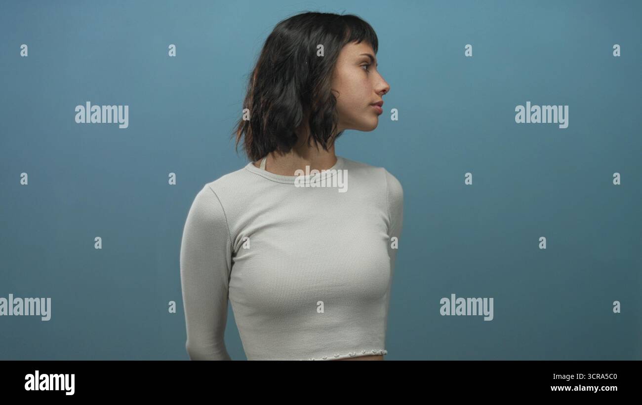 Young hispanic woman turns head hi-res stock photography and images - Alamy