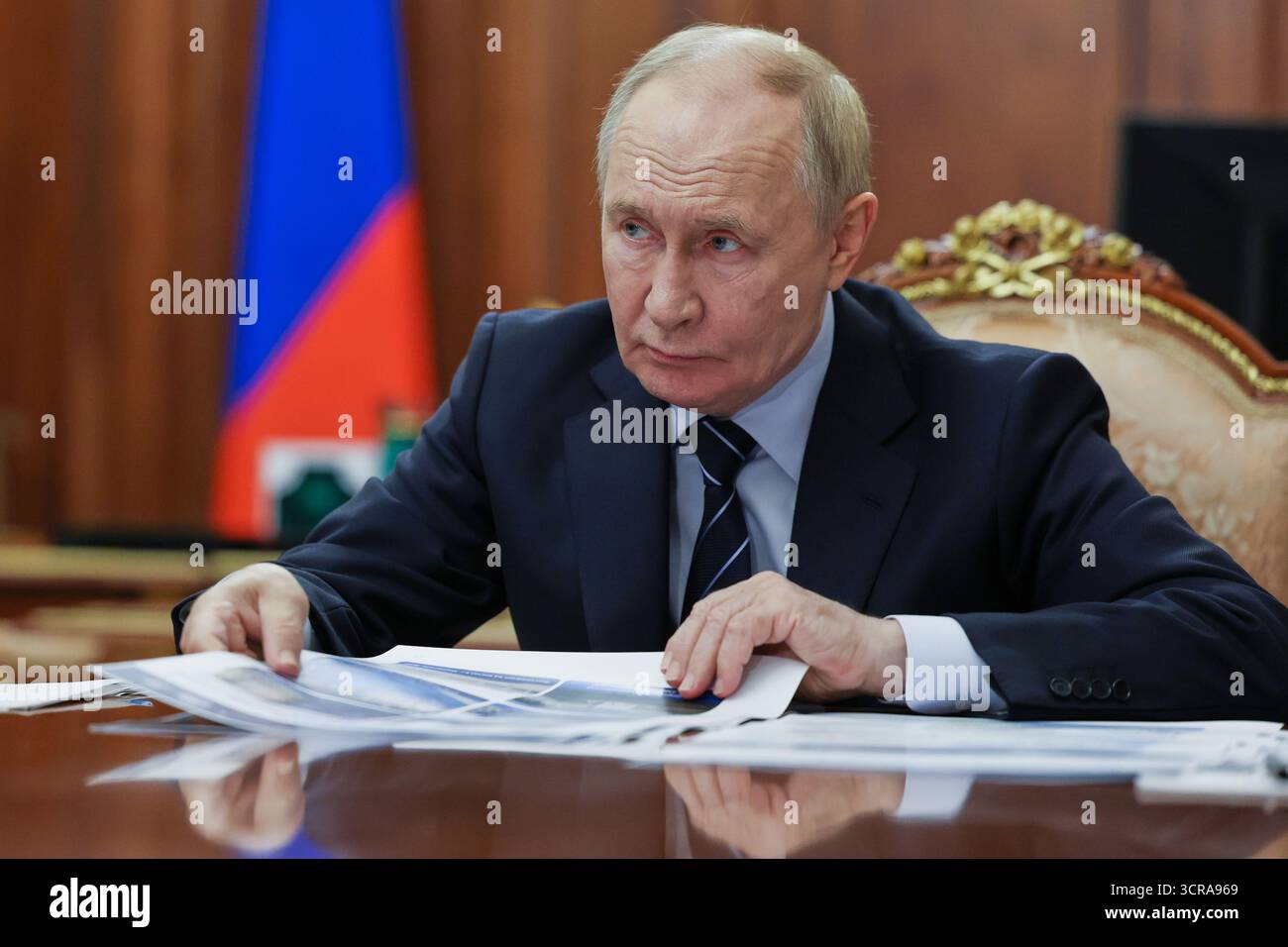 Russian President Vladimir Putin listens to Deputy Prime Minister Marat ...