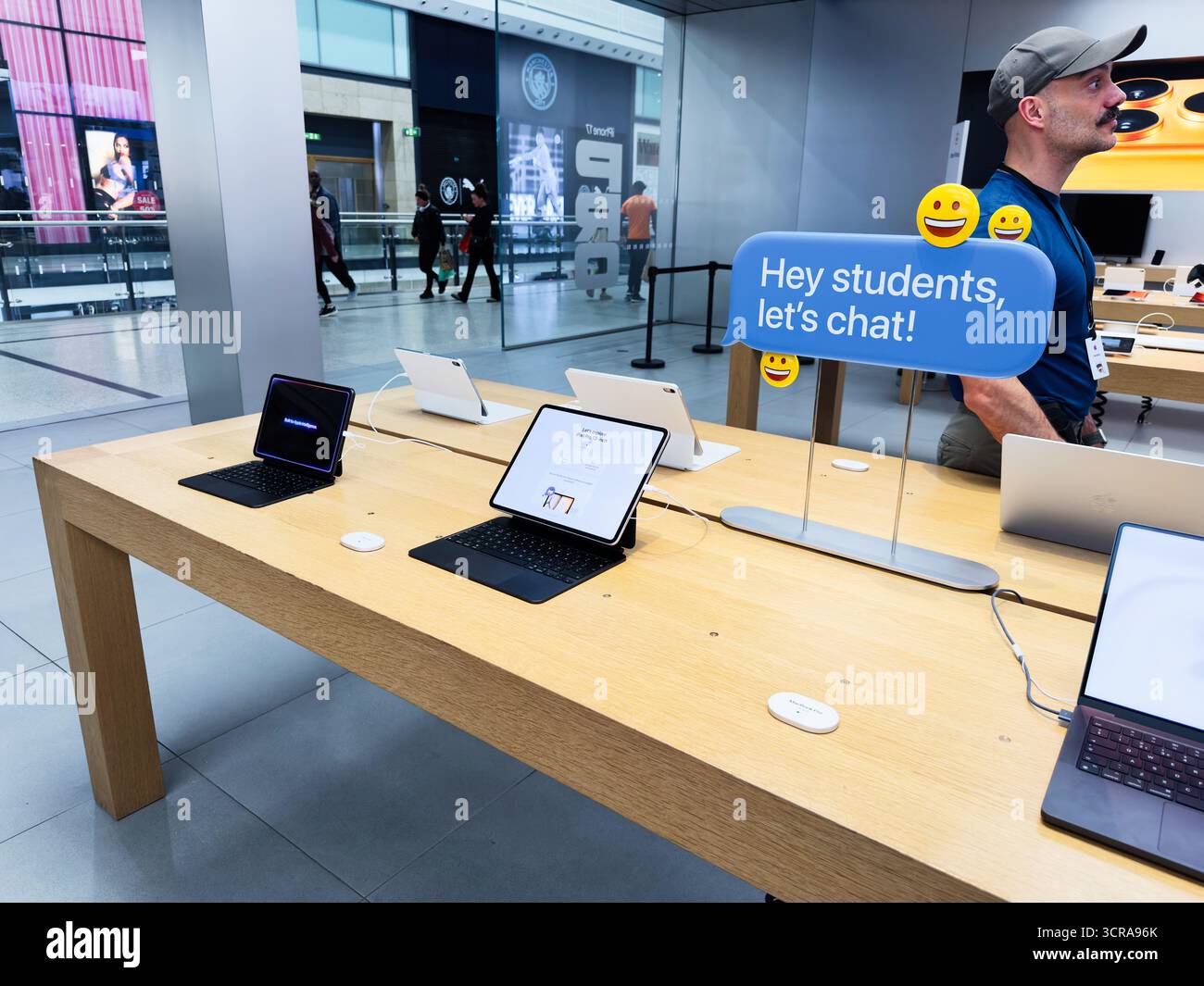Manchester, UK - September 29, 2025: Laptops and tablets on a wooden ...