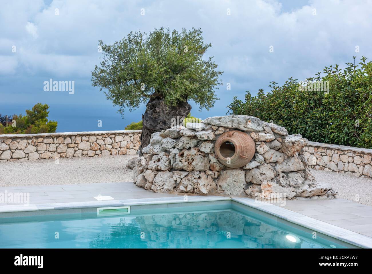 Greek urn water feature and swimming pool at a luxury Greek holiday ...