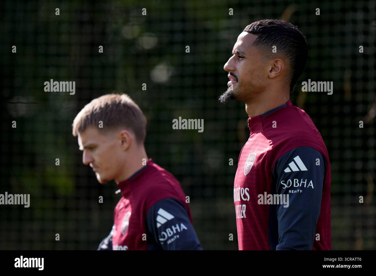 Arsenal's Martin Odegaard and William Saliba (right)during a training ...