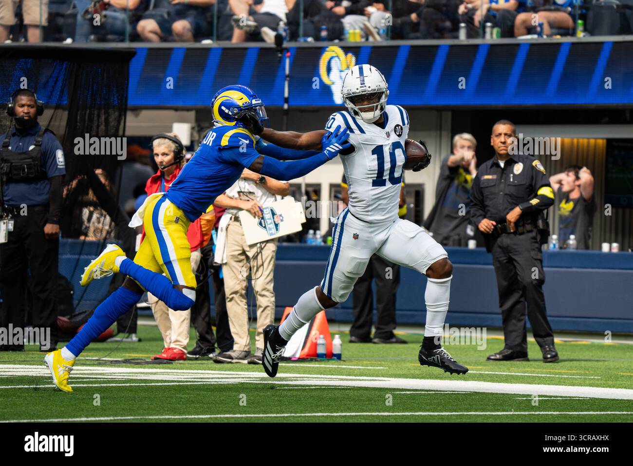 Indianapolis Colts wide receiver Adonai Mitchell (10) stiffs arms Los ...