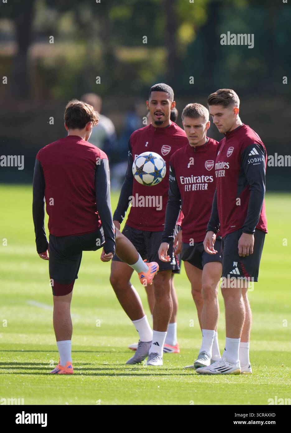 Arsenal's Viktor Gyokeres (right), Martin Odegaard (centre) and William ...