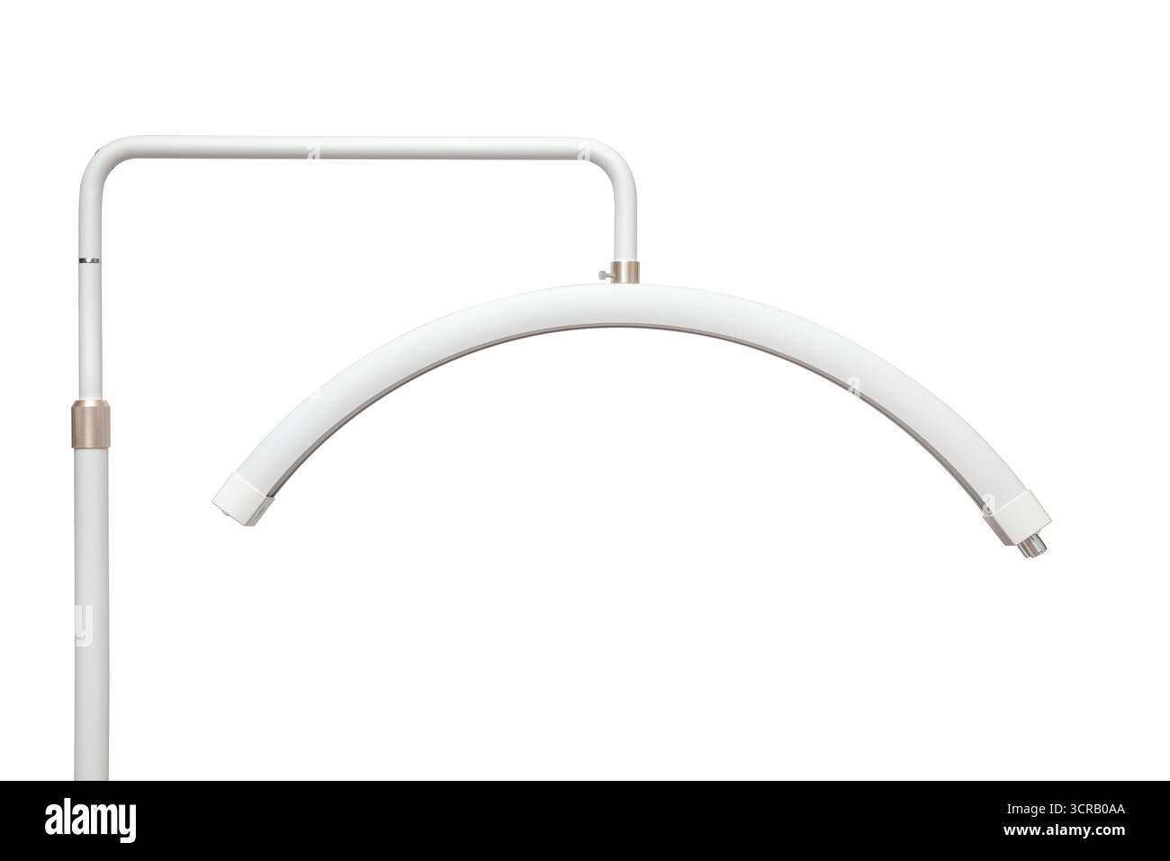 A modern white arched LED floor lamp for beauty or studio work ...