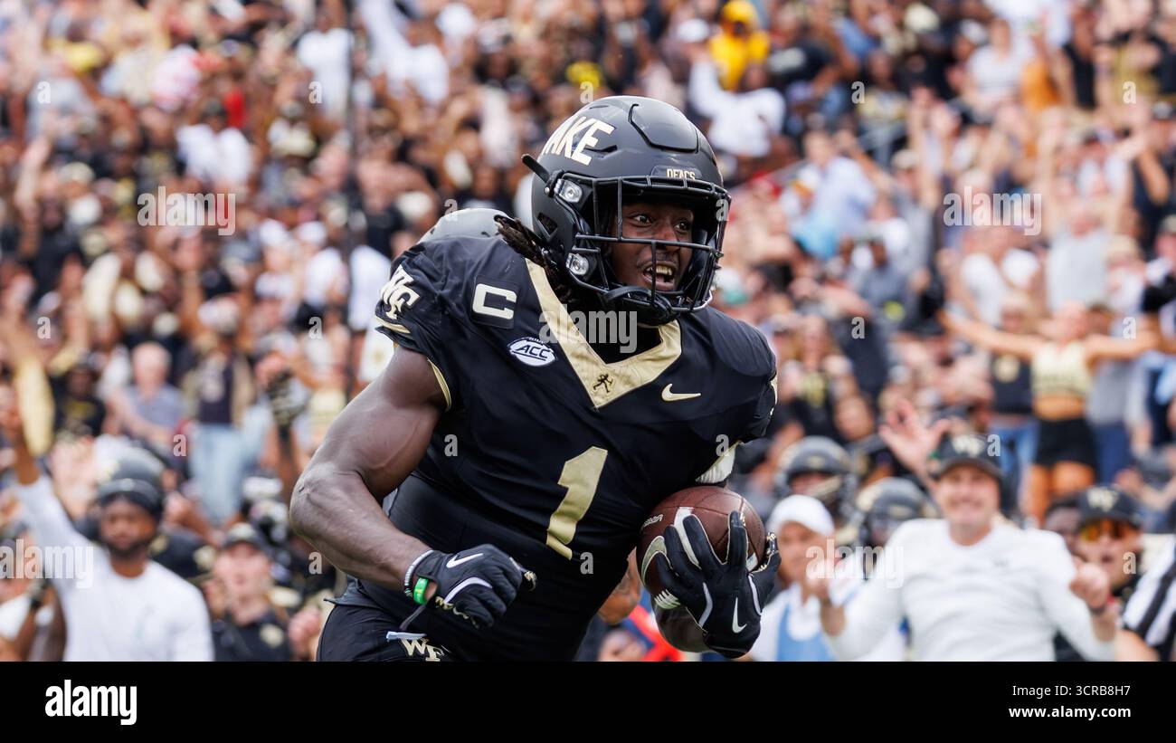 Wake Forest's Demond Claiborne (1) carries the ball during an NCAA ...