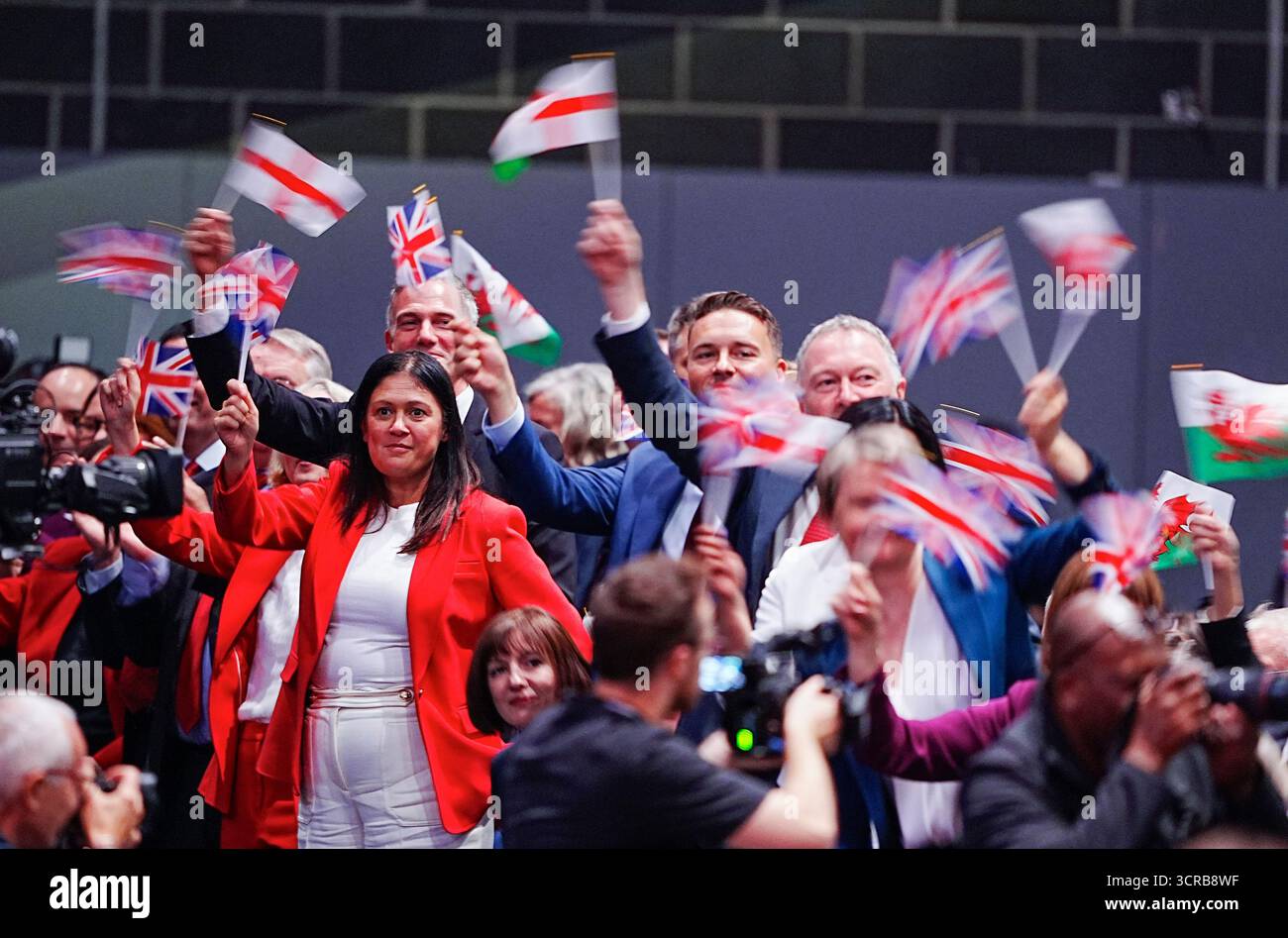 Cabinet ministers wave flags during Prime Minister Sir Keir Starmer's ...