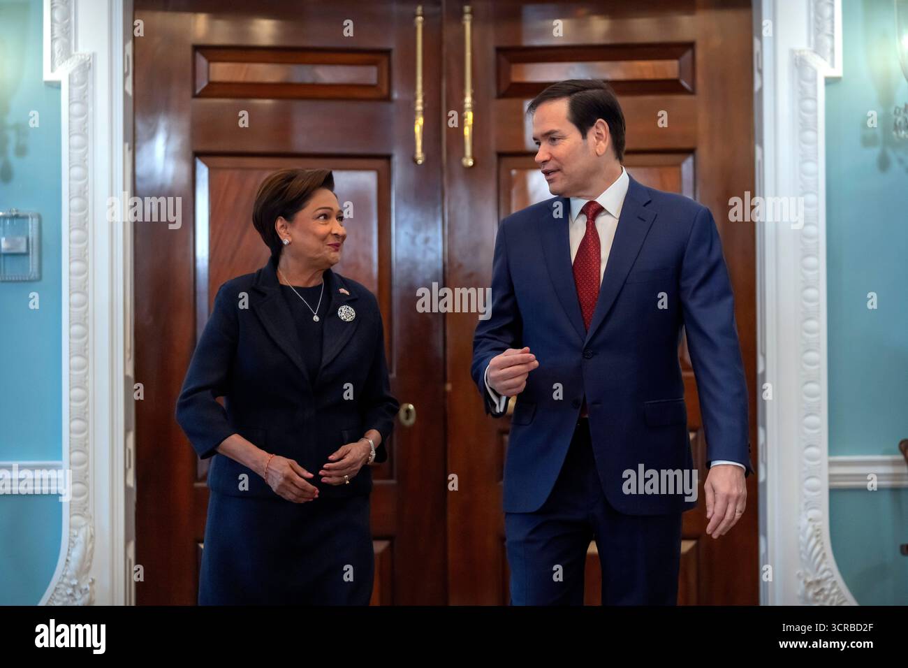 Secretary of State Marco Rubio, right, walks with Trinidad and Tobago ...