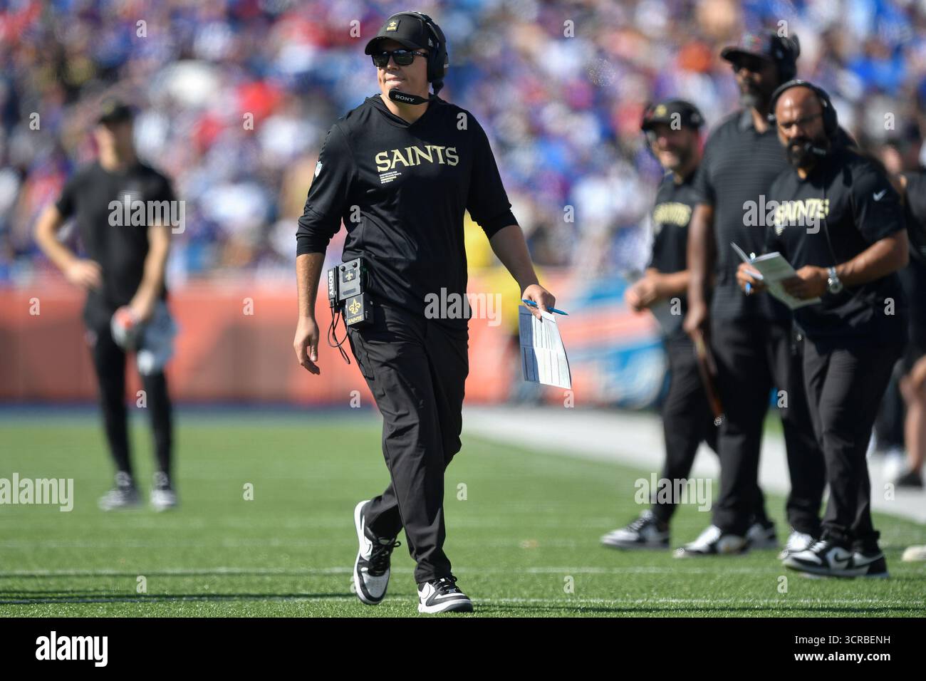 New Orleans Saints head coach Kellen Moore walks on the field during ...