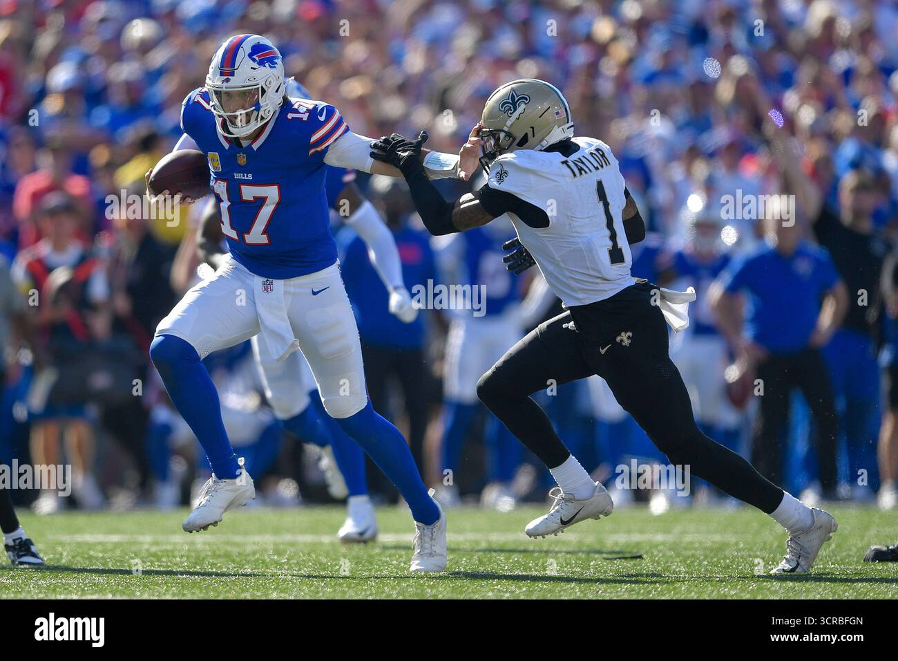 Buffalo Bills quarterback Josh Allen (17) stiff arms New Orleans Saints ...