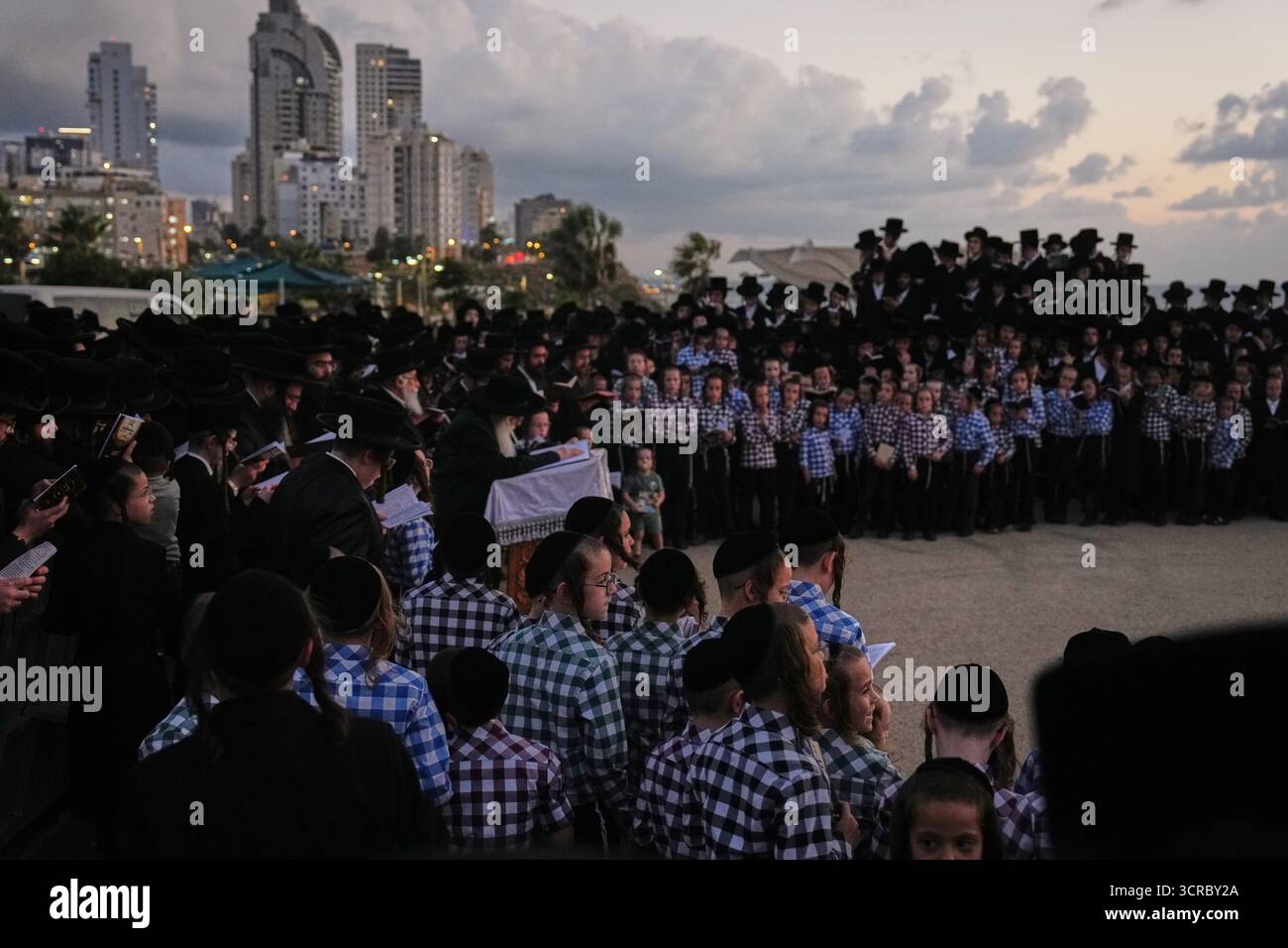 Ultra-Orthodox Jewish men and children of the Kiryat Sanz Hassidic sect ...