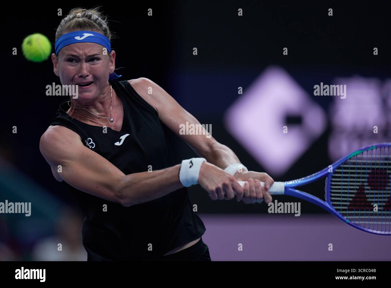 Marie Bouzkova of the Czech Republic plays a shot against Jasmine ...