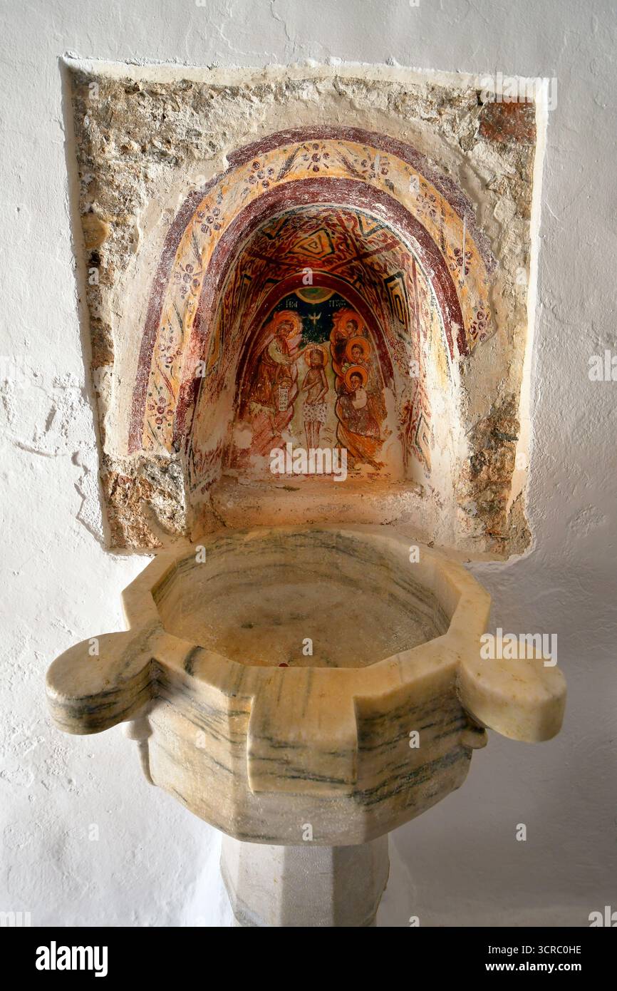 Amorgos Greece - September 09, 2025: Marble baptismal font with old ...