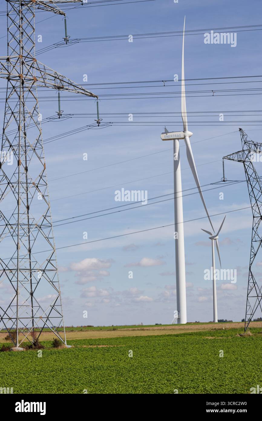 Wind turbines and electricity pylons. Generation of electrical power ...