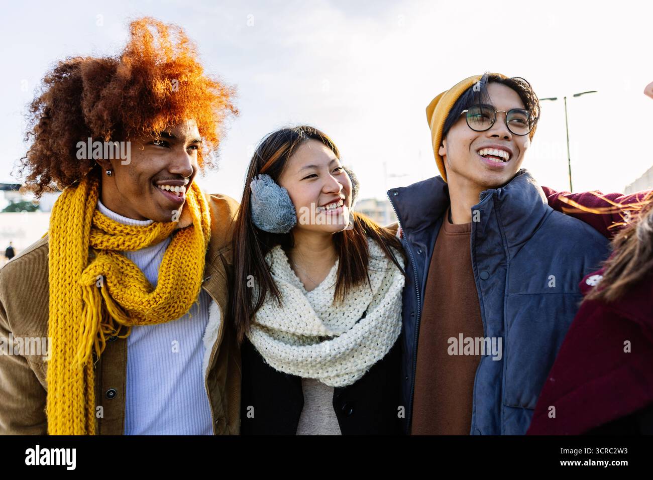 Diverse group of gen z happy friends having fun together on winter ...
