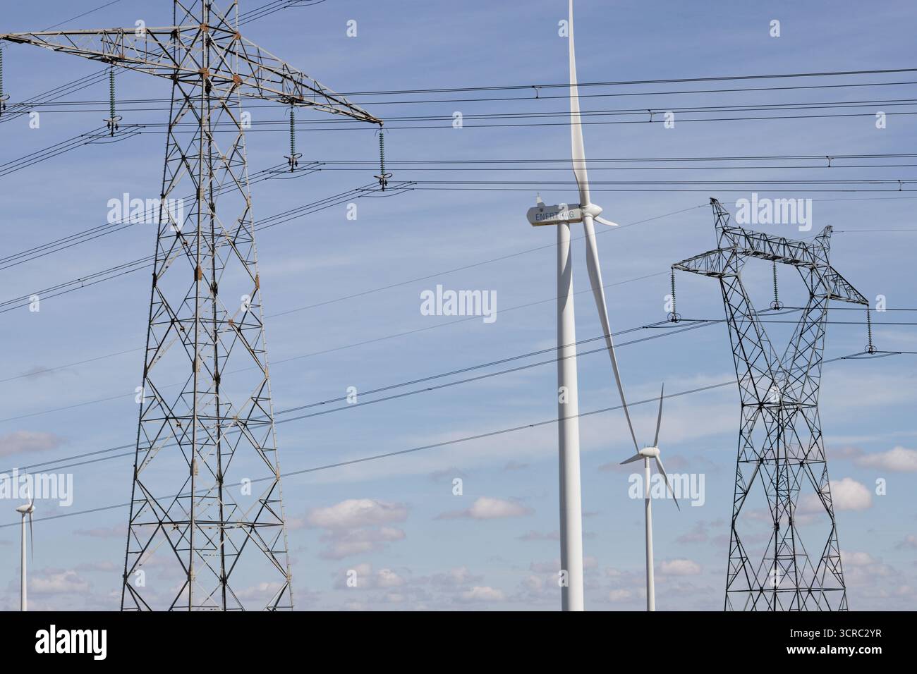 Wind turbines and electricity pylons. Generation of electrical power ...