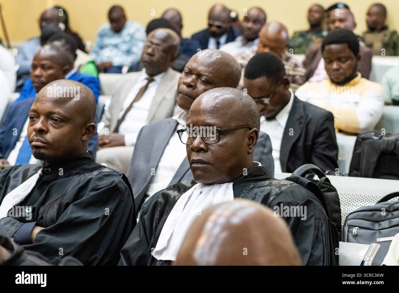 Lawyers and members of the public attend the trial of former Congolese ...