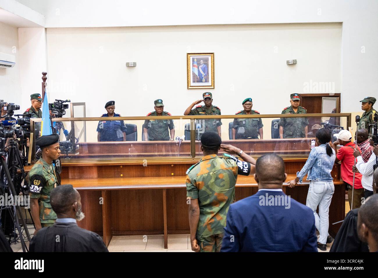 Military officers stand in the dock during the trial of former ...