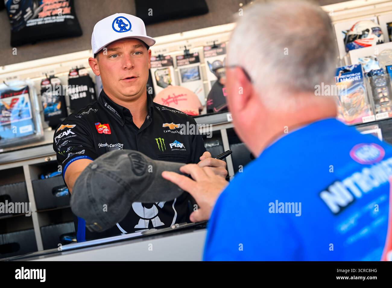 MADISON, IL - SEPTEMBER 26: Austin Prock (1) Funny Car signs an ...