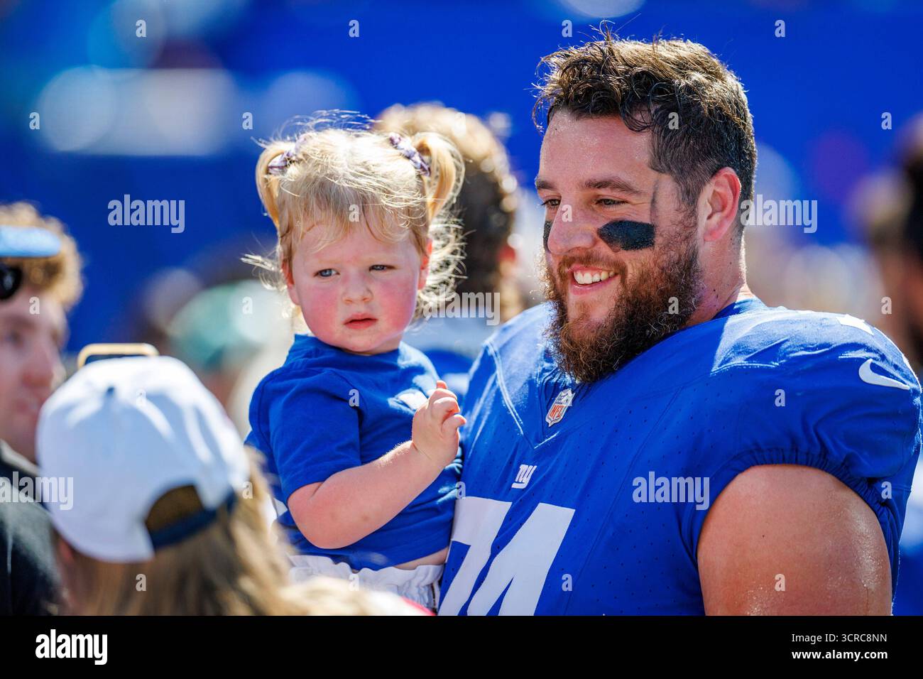 New York Giants guard Greg van Roten (74) smiles with his daughter and ...