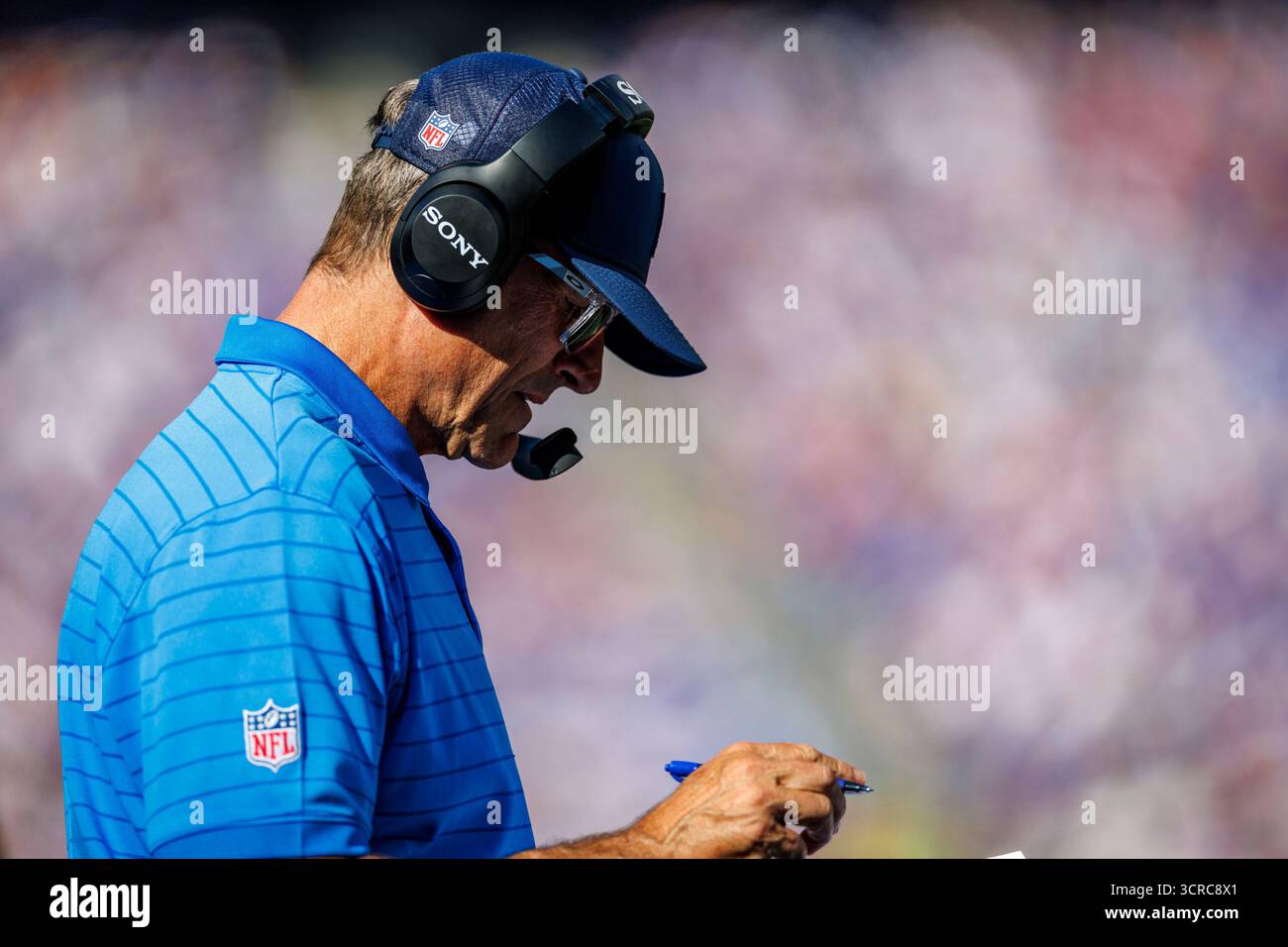 Los Angeles Chargers head coach Jim Harbaugh looks over plays during an ...