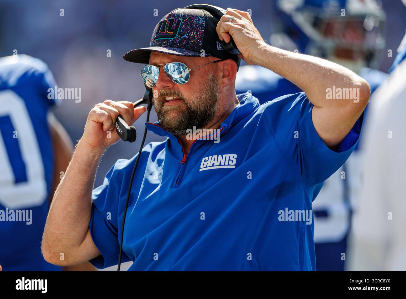 New York Giants head coach Brian Dabol walks the sidelines during an NFL football game against ...