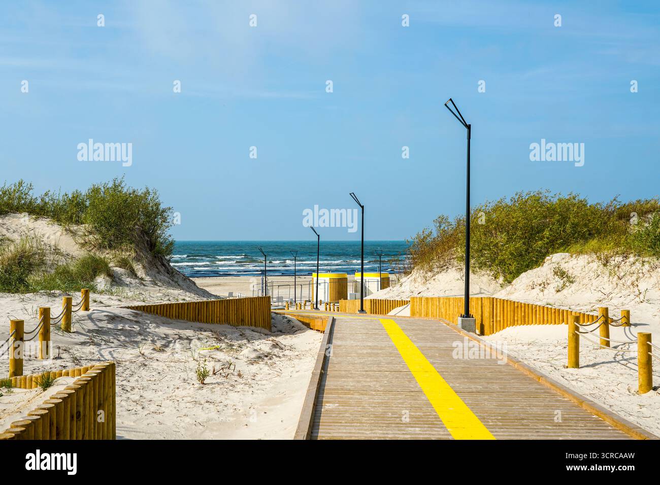 Modern wooden beach walkway with lights and dunes, Baltic Sea access ...