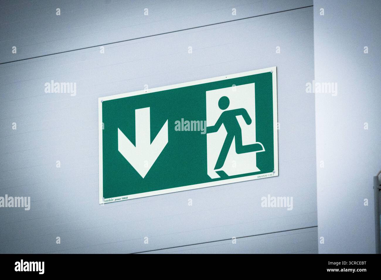 Augsburg, Bavaria, Germany - September 30, 2025: Green emergency exit ...