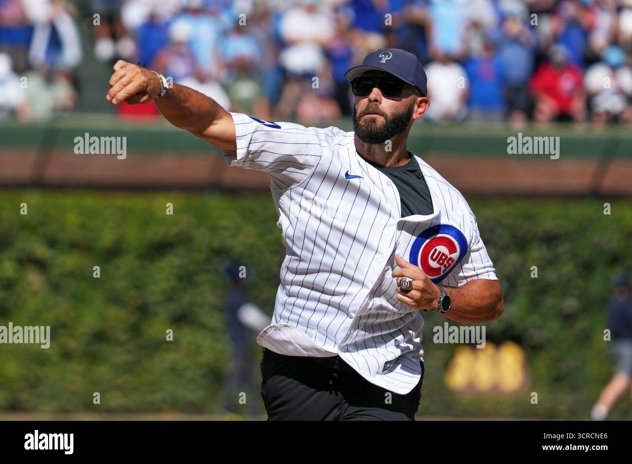 Former Chicago Cubs' Jake Arrieta throws a ceremonial first pitch ...