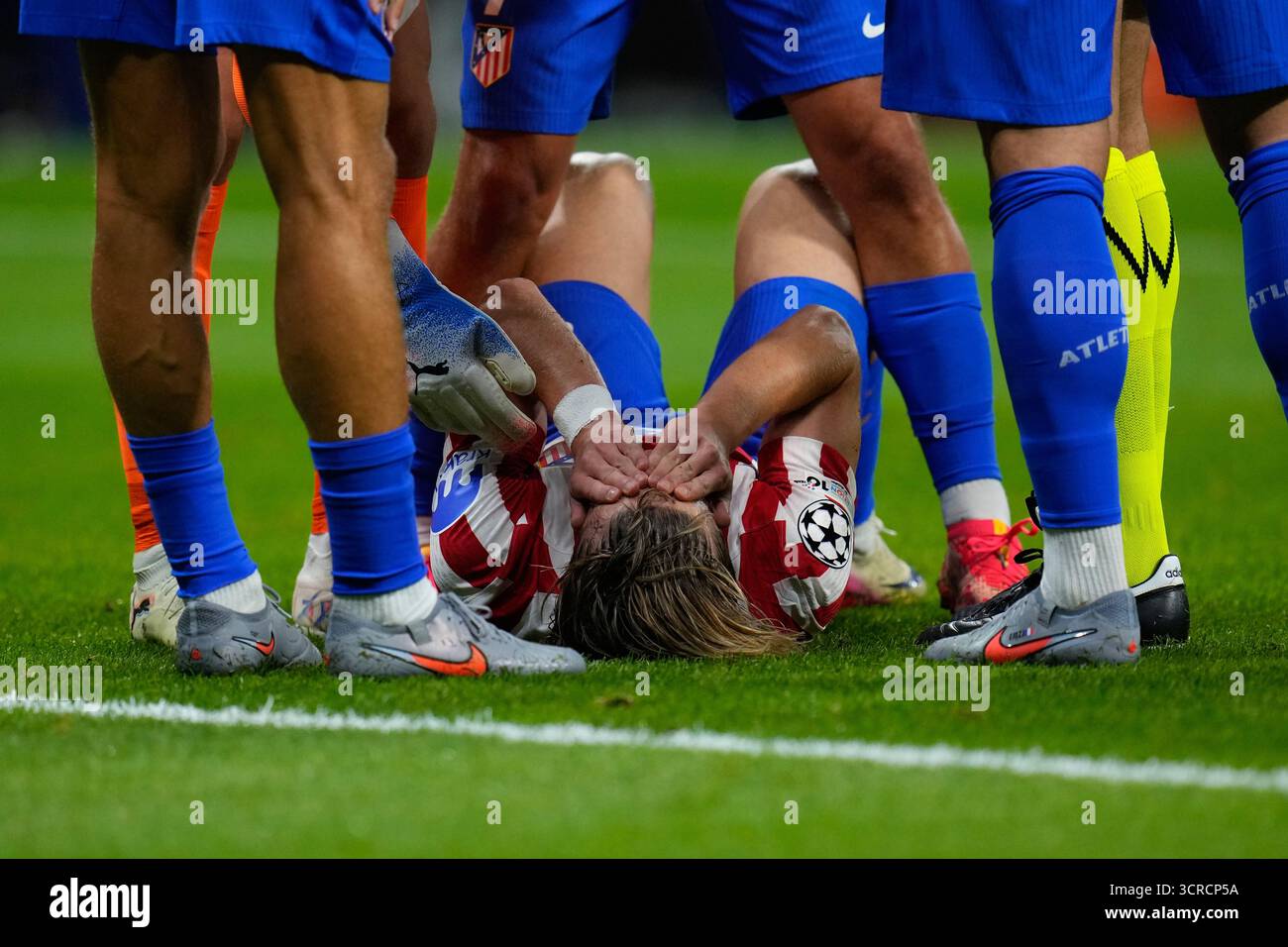 Atletico Madrid's Marcos Llorente covers his face during the Champions ...