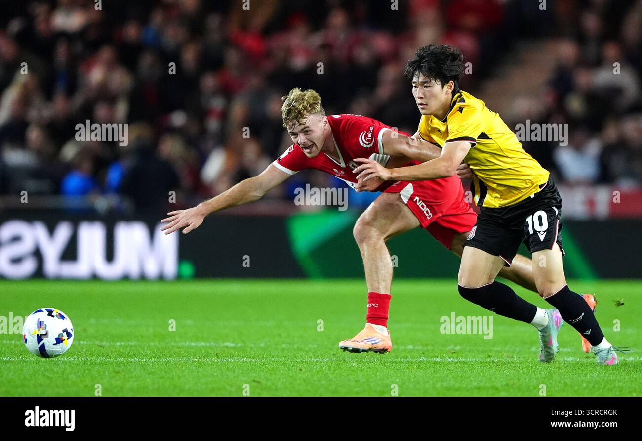 Middlesbrough's Tommy Conway (left) and Stoke City's Bae Jun-Ho battle ...