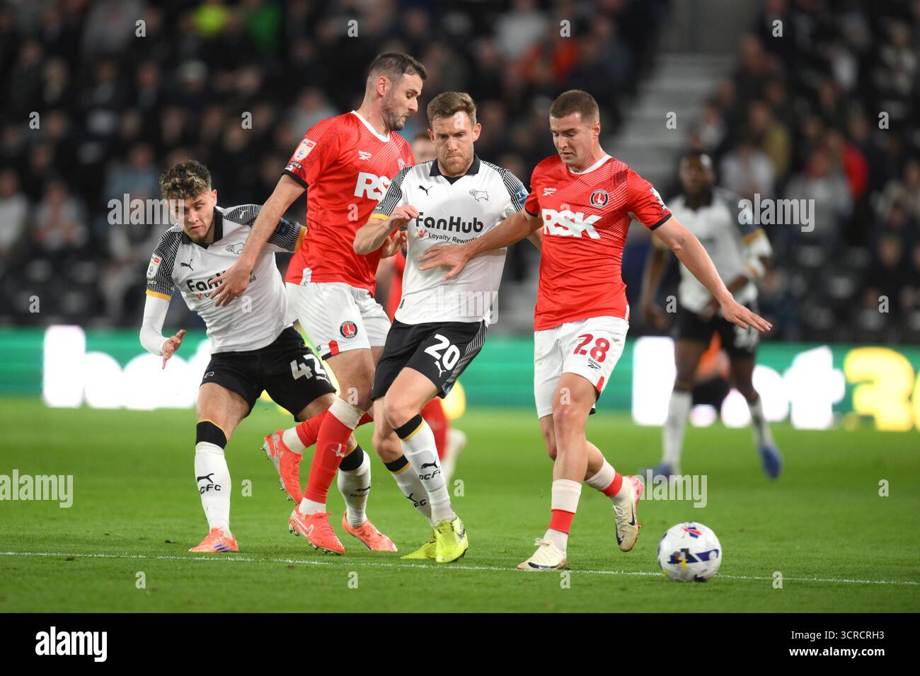 Derby County's Callum Elder (centre) and Derby County's Dion Sanderson ...