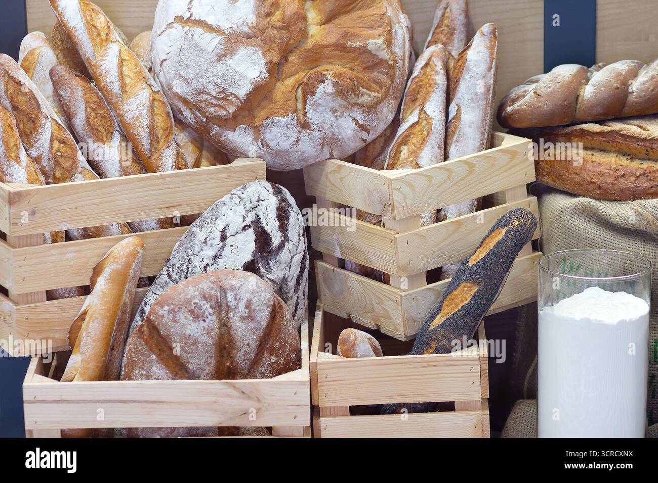 Different kinds of fresh bread on the bakery counter. Food Stock Photo ...
