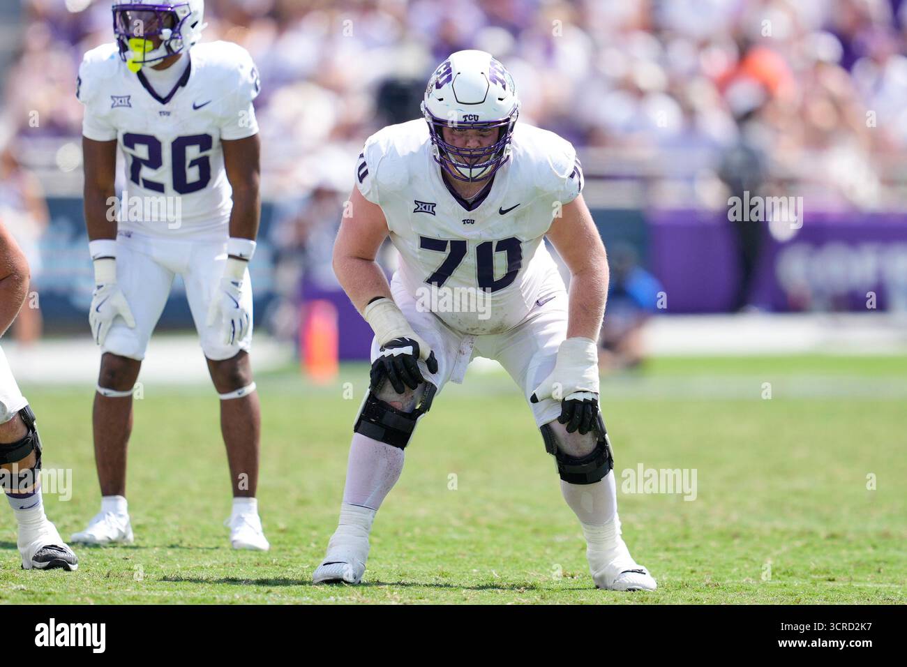 TCU offensive lineman Ryan Hughes (70) and running back Jeremy Payne ...