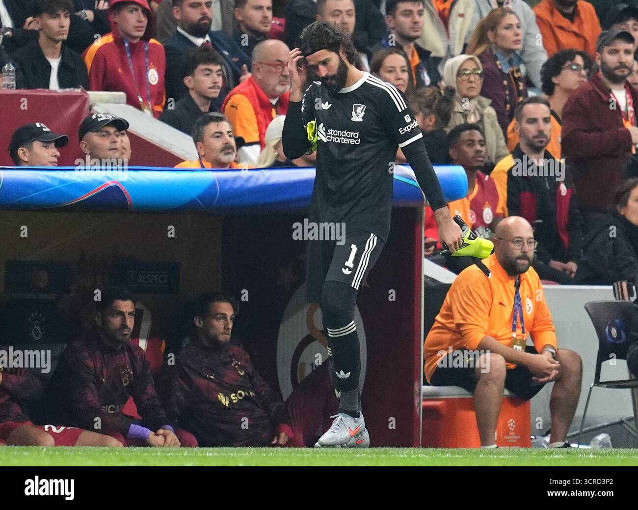 Liverpool goalkeeper Alisson Becker looks on after being substituted ...