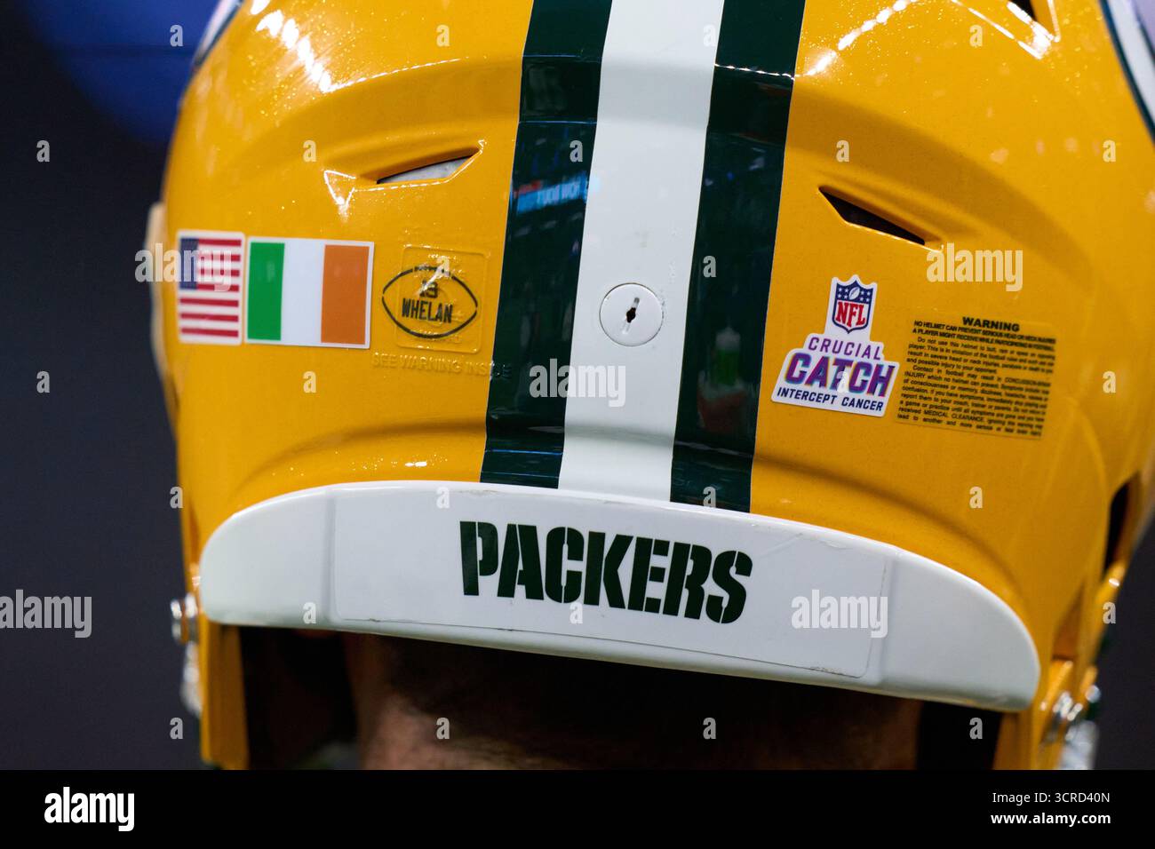 The Irish flag decal is seen on the helmet of Green Bay Packers punter ...