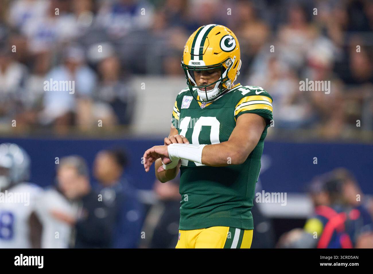 Green Bay Packers quarterback Jordan Love (10) looks at plays during an ...