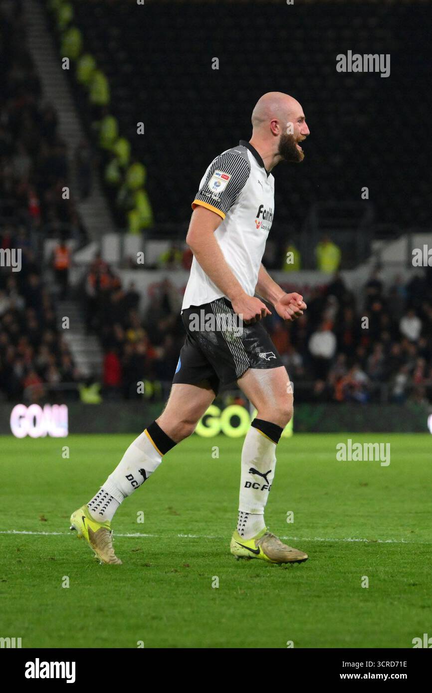 Derby County's Matthew Clarke (centre) celebrates scoring their side's ...