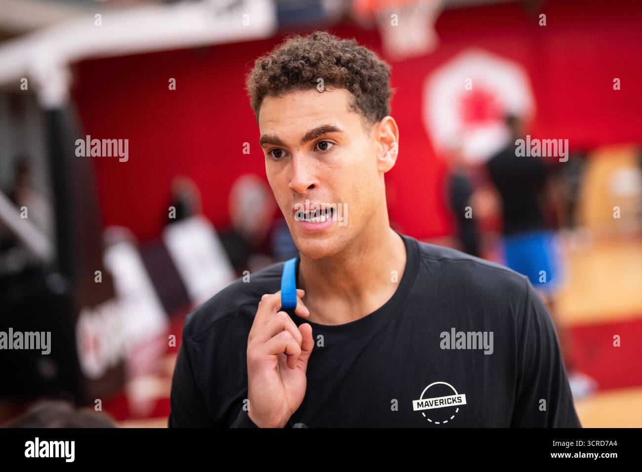 Dallas Mavericks' Dwight Powell speaks with a reporter at NBA ...