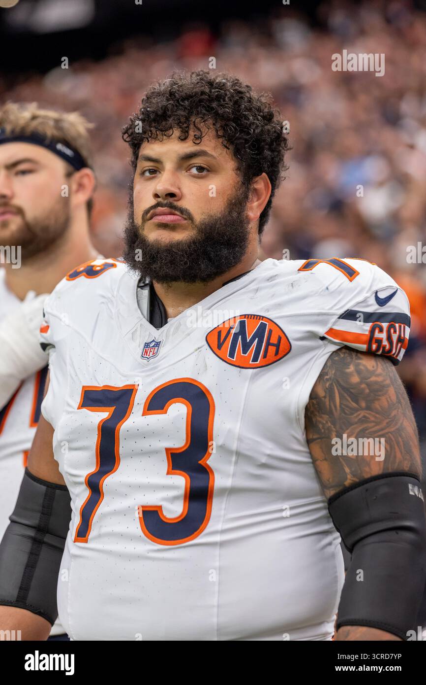 Chicago Bears guard Jonah Jackson (73) stands for the national anthem ...