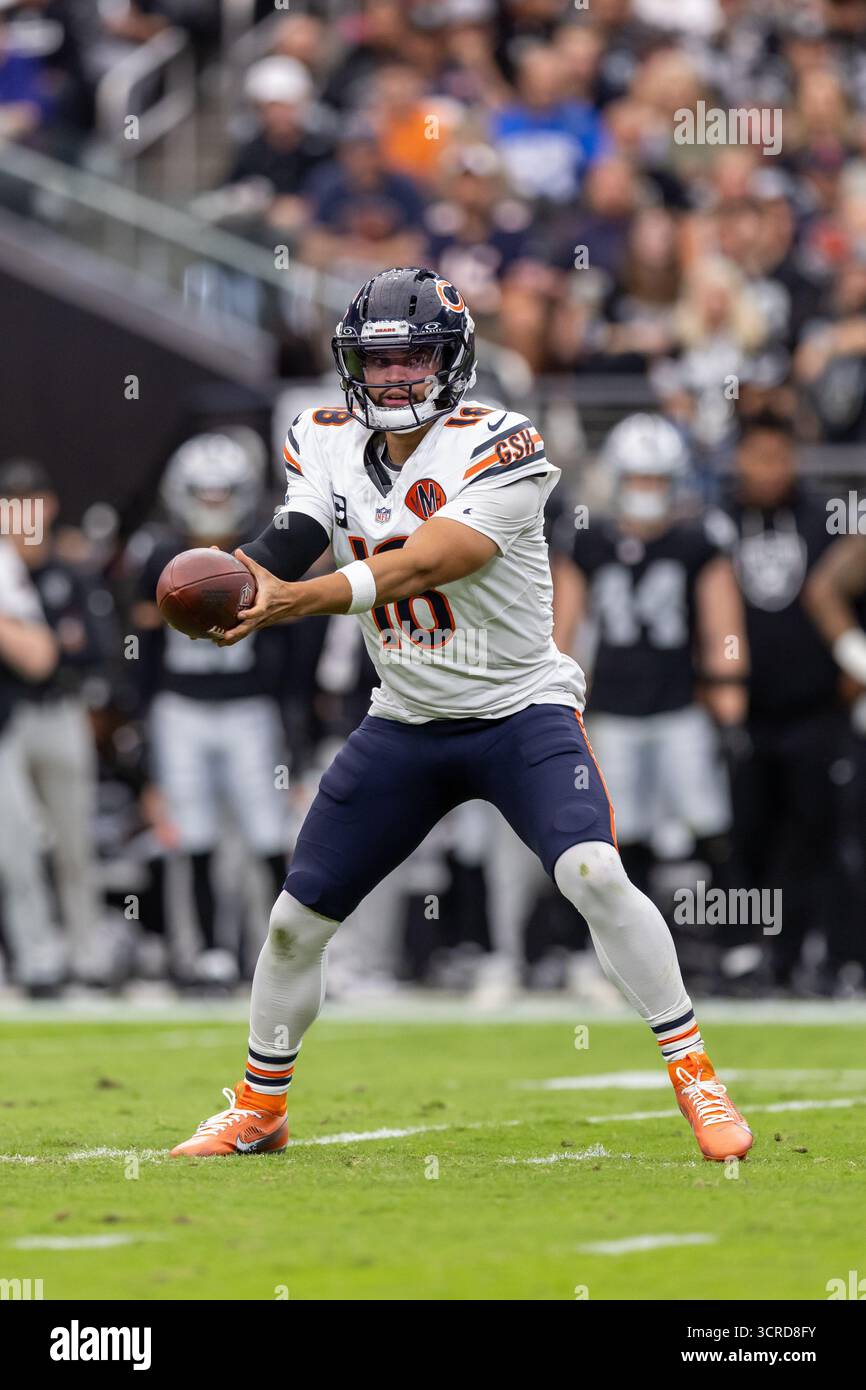 Chicago Bears quarterback Caleb Williams (18) turns to hand off against ...