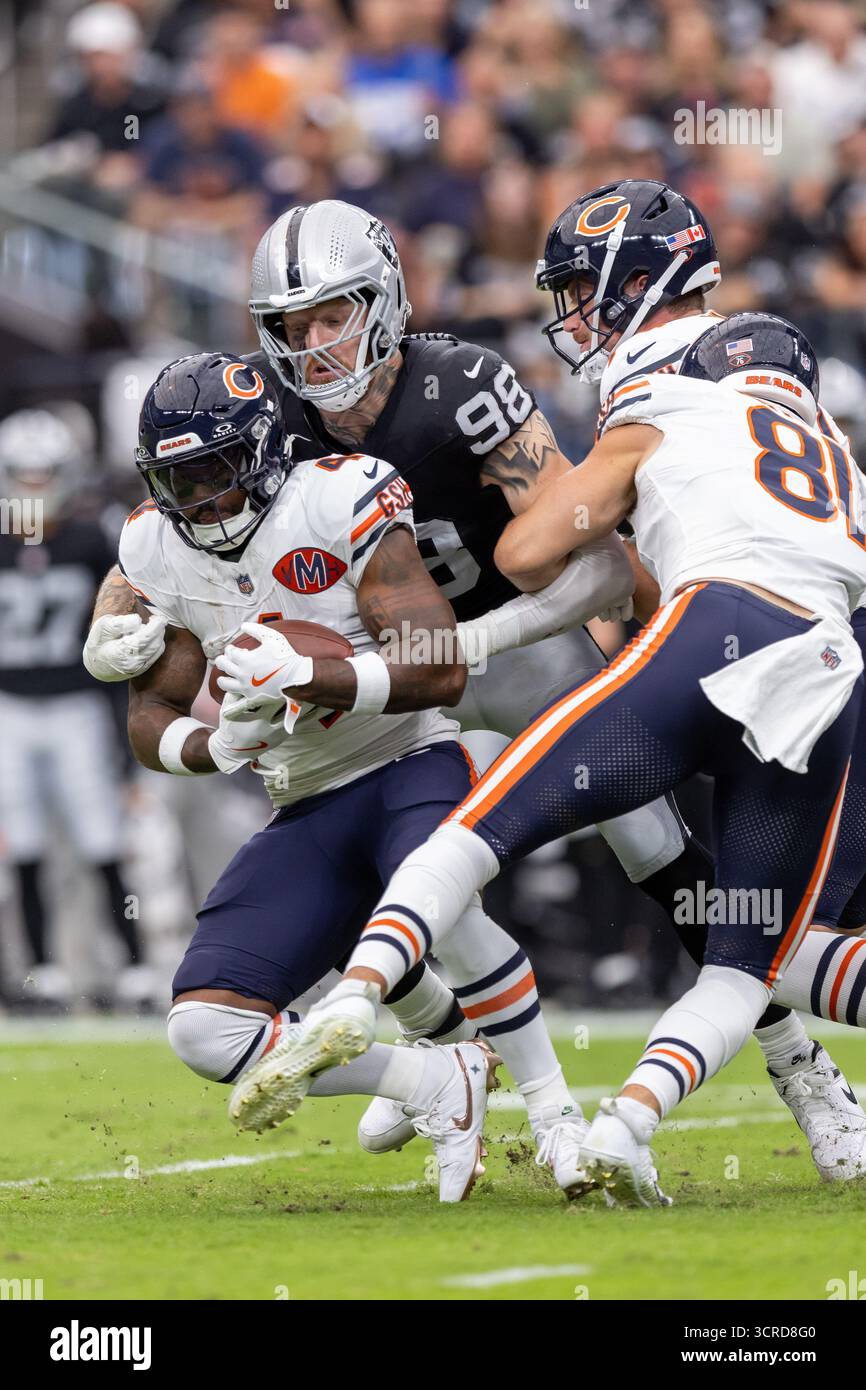 Chicago Bears running back D'Andre Swift (4) runs the ball and is tackled by Las Vegas Raiders ...