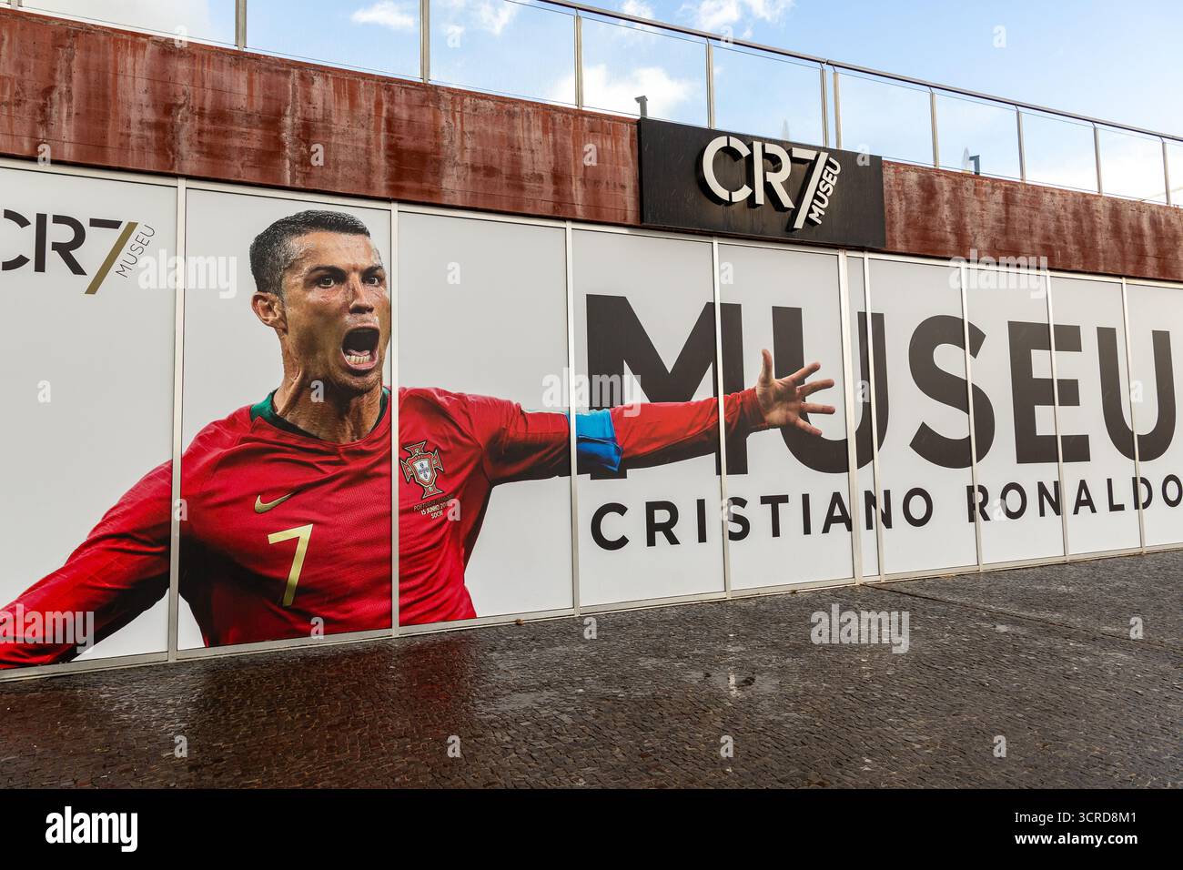 Exterior view of the CR7 Museum with large mural featuring Cristiano ...