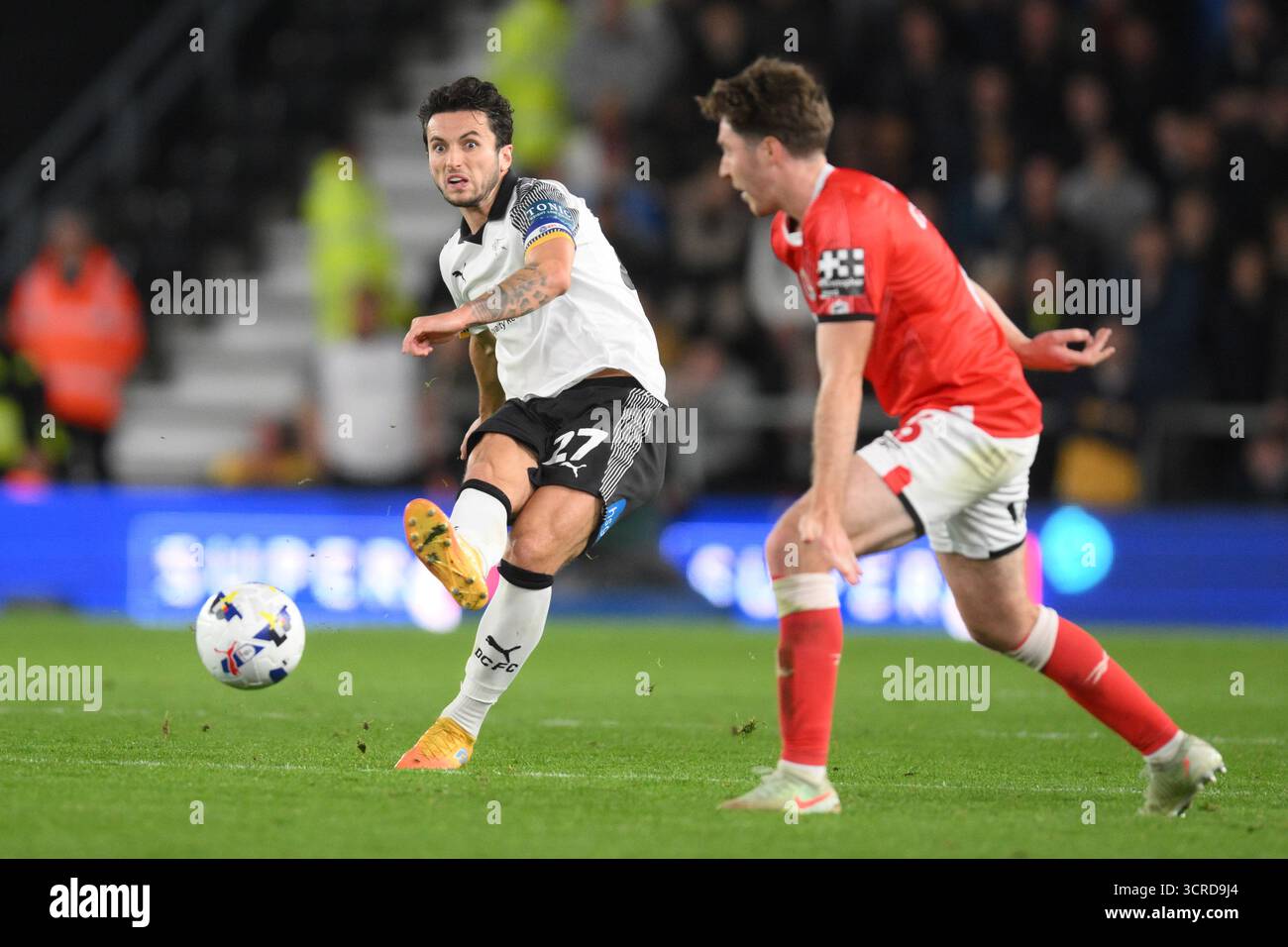 Derby County's Lewis Travis (left) in action during the Sky Bet ...