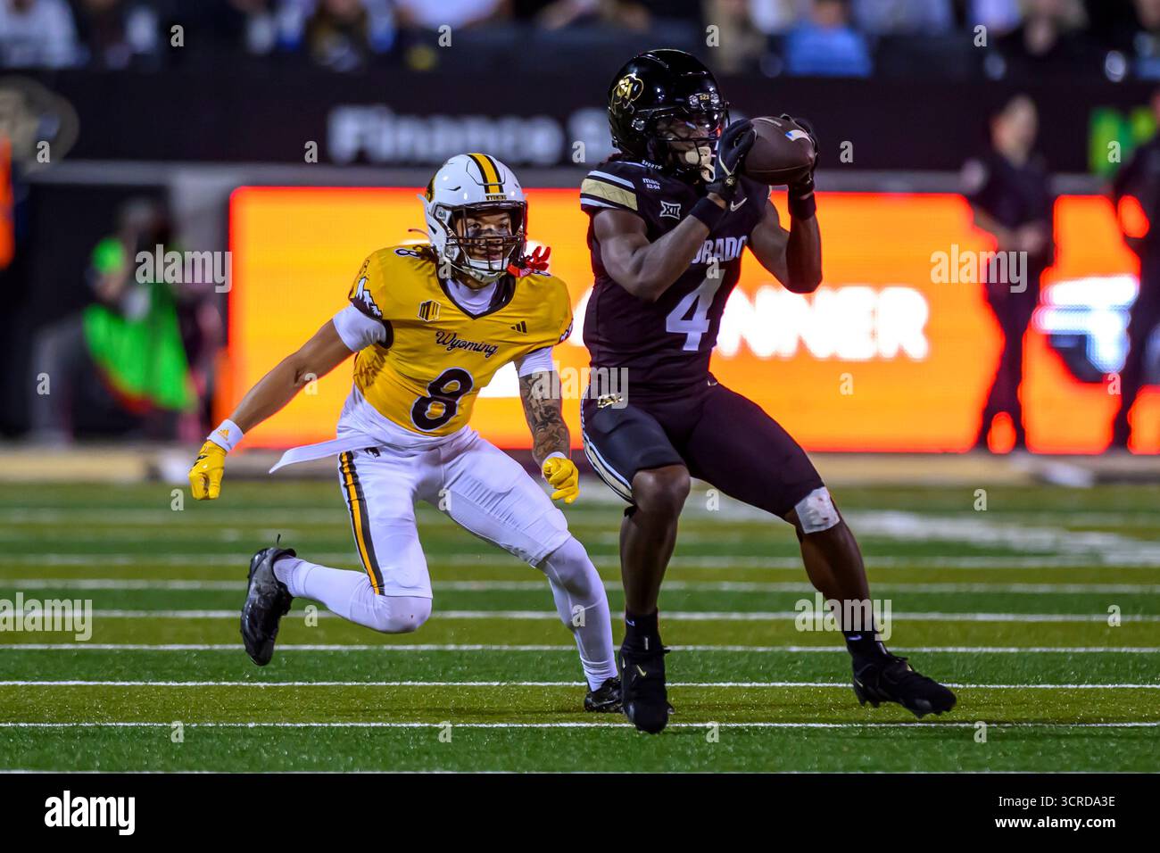 Colorado wide receiver Omarion Miller (4) makes the catch defended by ...