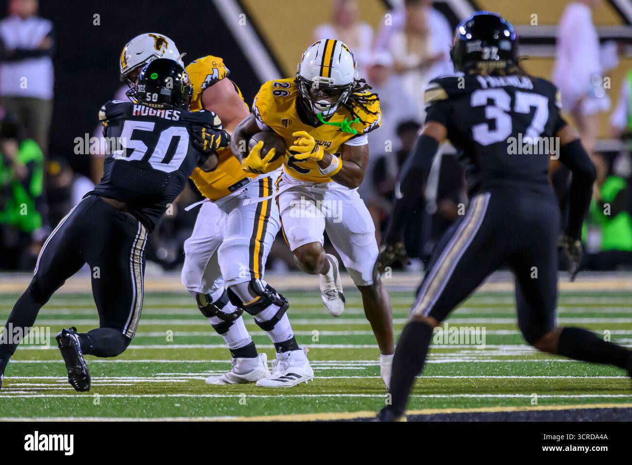 Wyoming running back Samuel Harris (26) runs the football during an ...