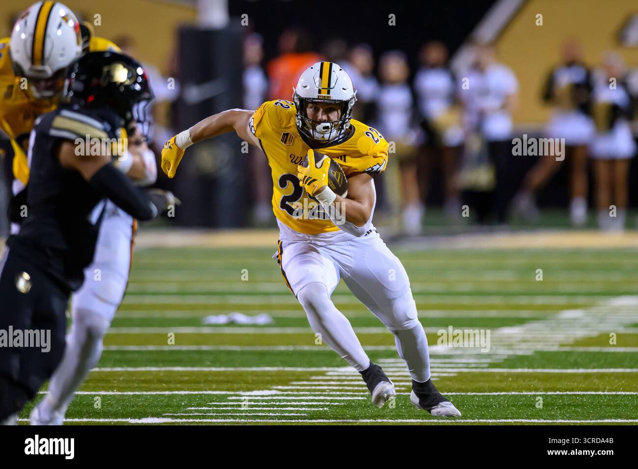 Wyoming running back Sam Scott (22) runs the football during an NCAA ...