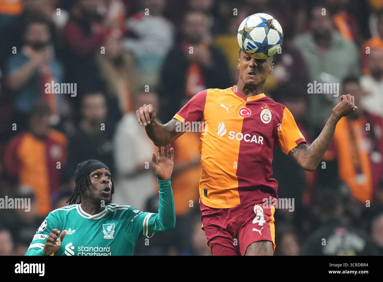 Galatasaray's Ismail Jakobs, right, jumps for a header challenged by ...