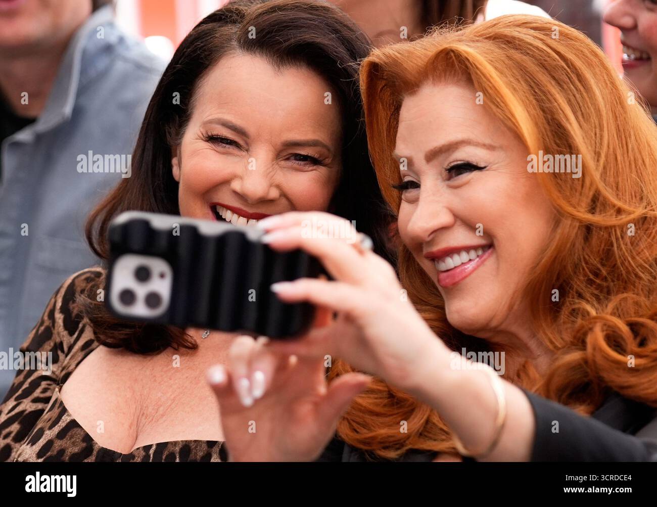 Actor Fran Drescher, left, poses for a photo with guest speaker Lisa ...