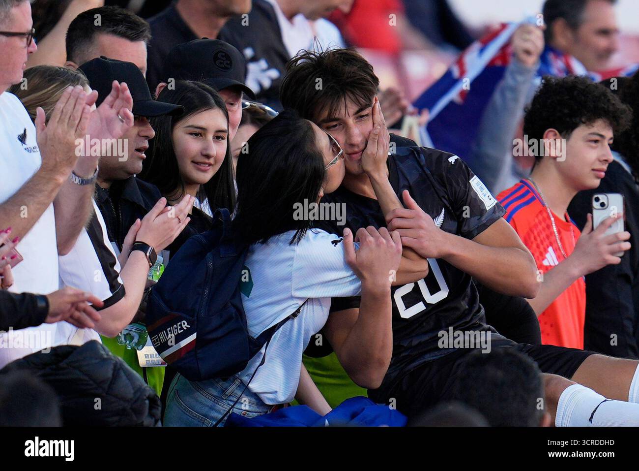 A woman kisses New Zealand's Stipe Ukich at the end of a FIFA U-20 ...