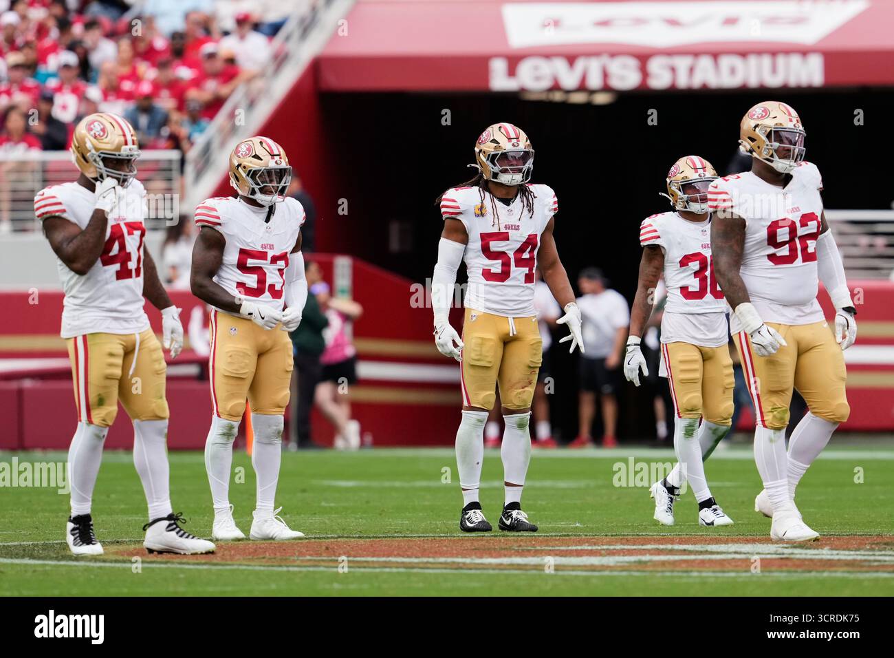 San Francisco 49ers defenders stand on the field during the second half ...
